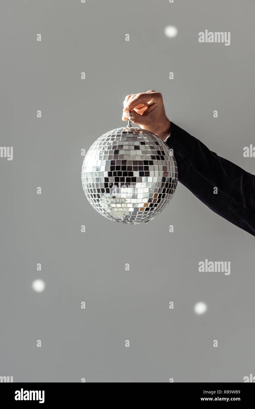 Man holding mirror ball hi-res stock photography and images - Alamy
