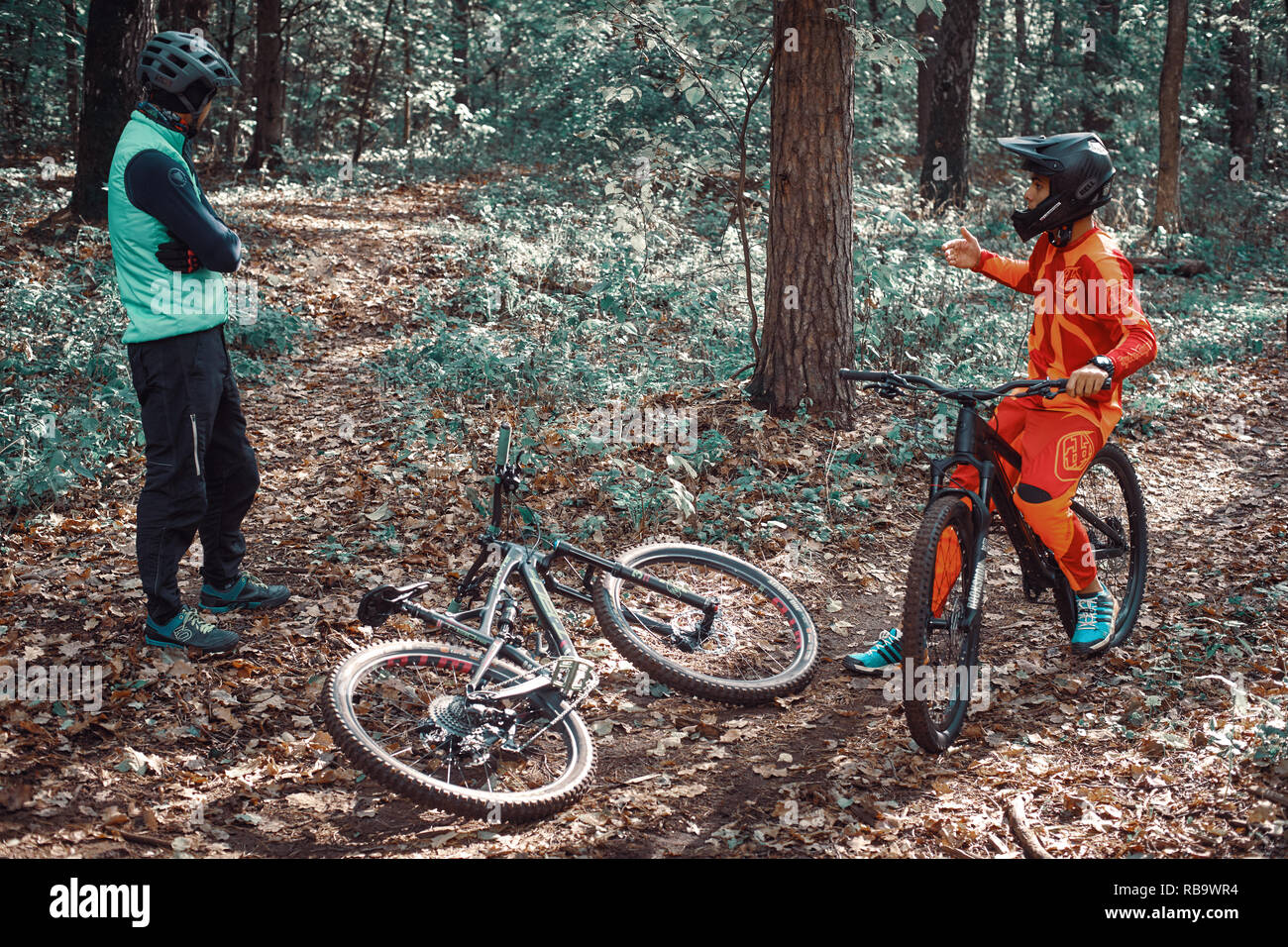 Moscow, Russia - Nov, 2018: MTB teacher helping rider learn to ride ...