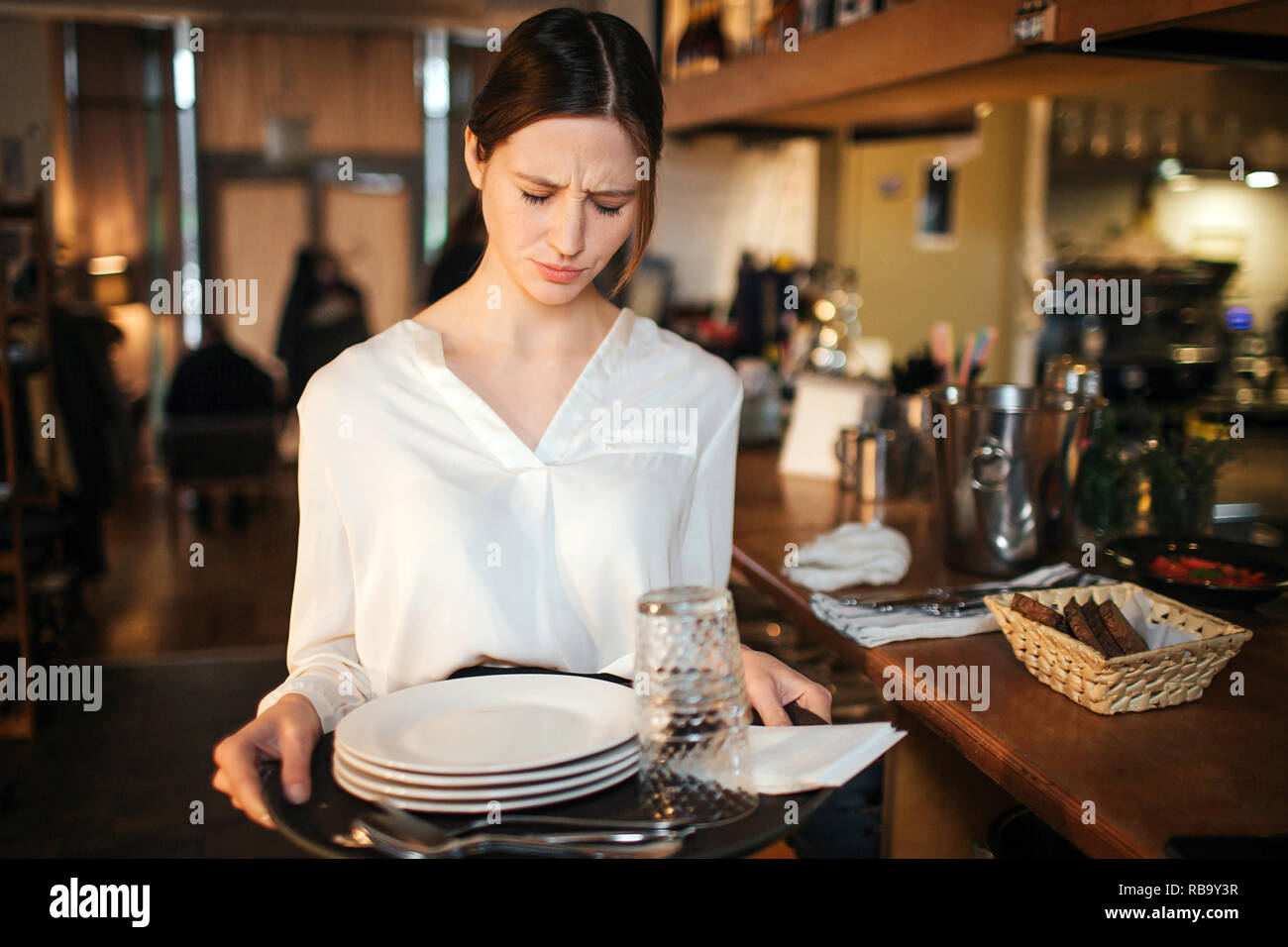 Waitress with plates hi-res stock photography and images - Alamy