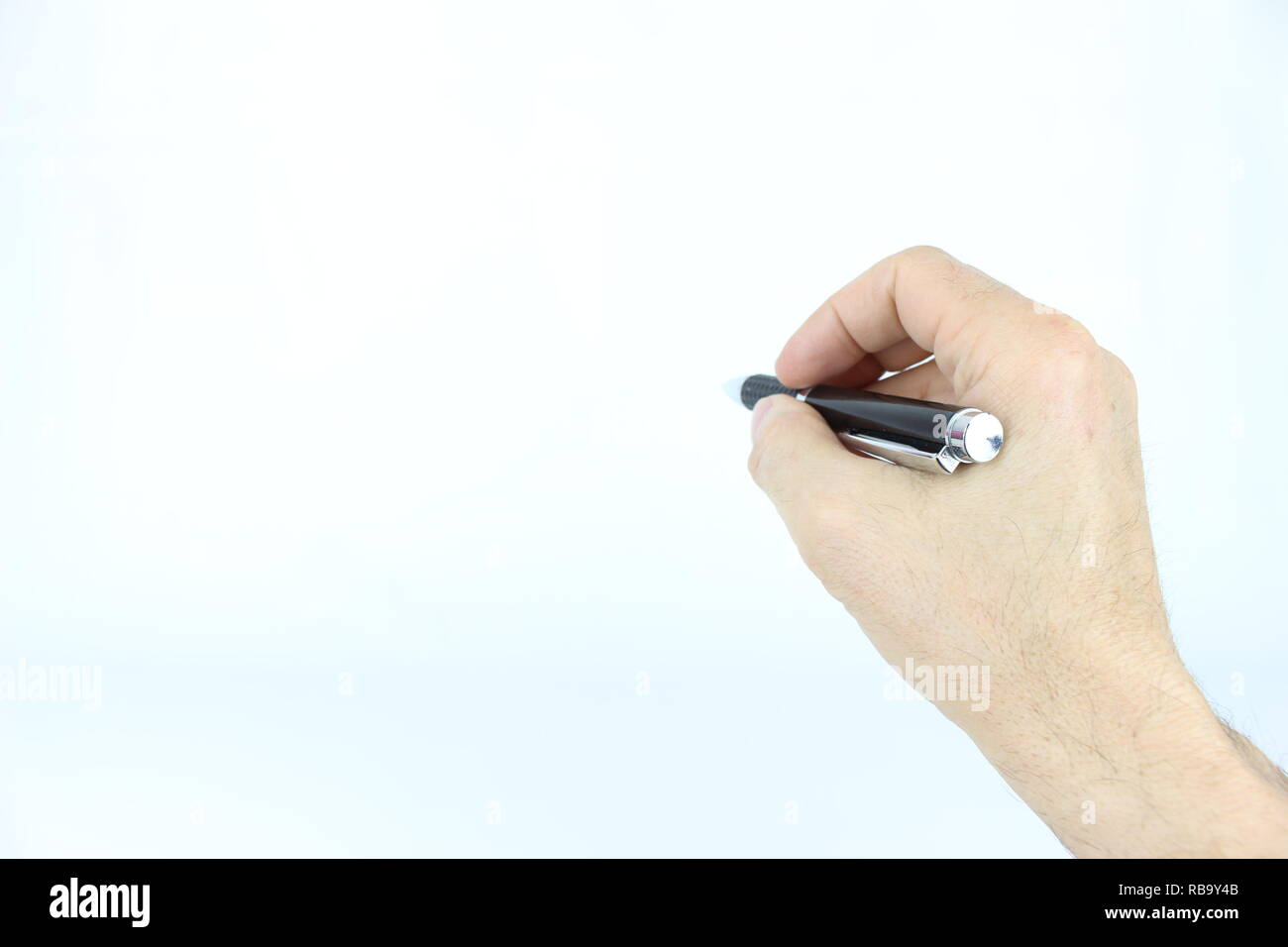 The right hand, of a man, holds a common object, a pen sphere Stock ...