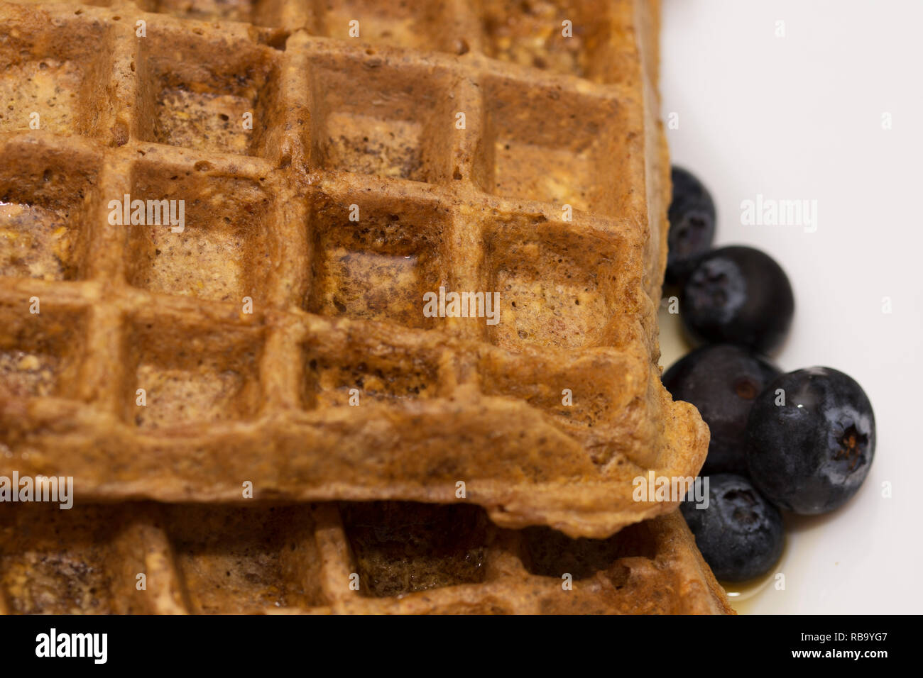 Waffles with Fruit and Maple Syrup on a Plate on the Kitchen Counter ...