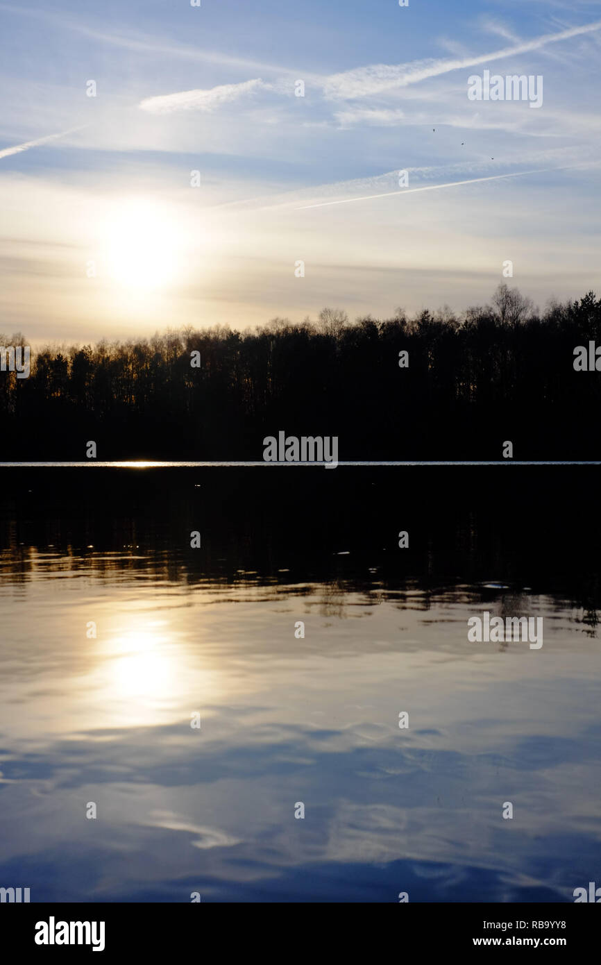 Beautiful lake and forest during sunset Stock Photo - Alamy
