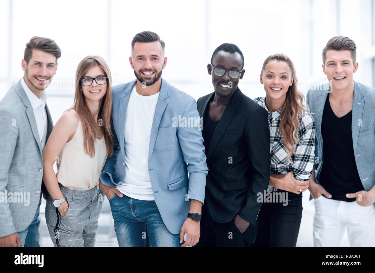 Happy group of people standing in a row over white background Stock ...