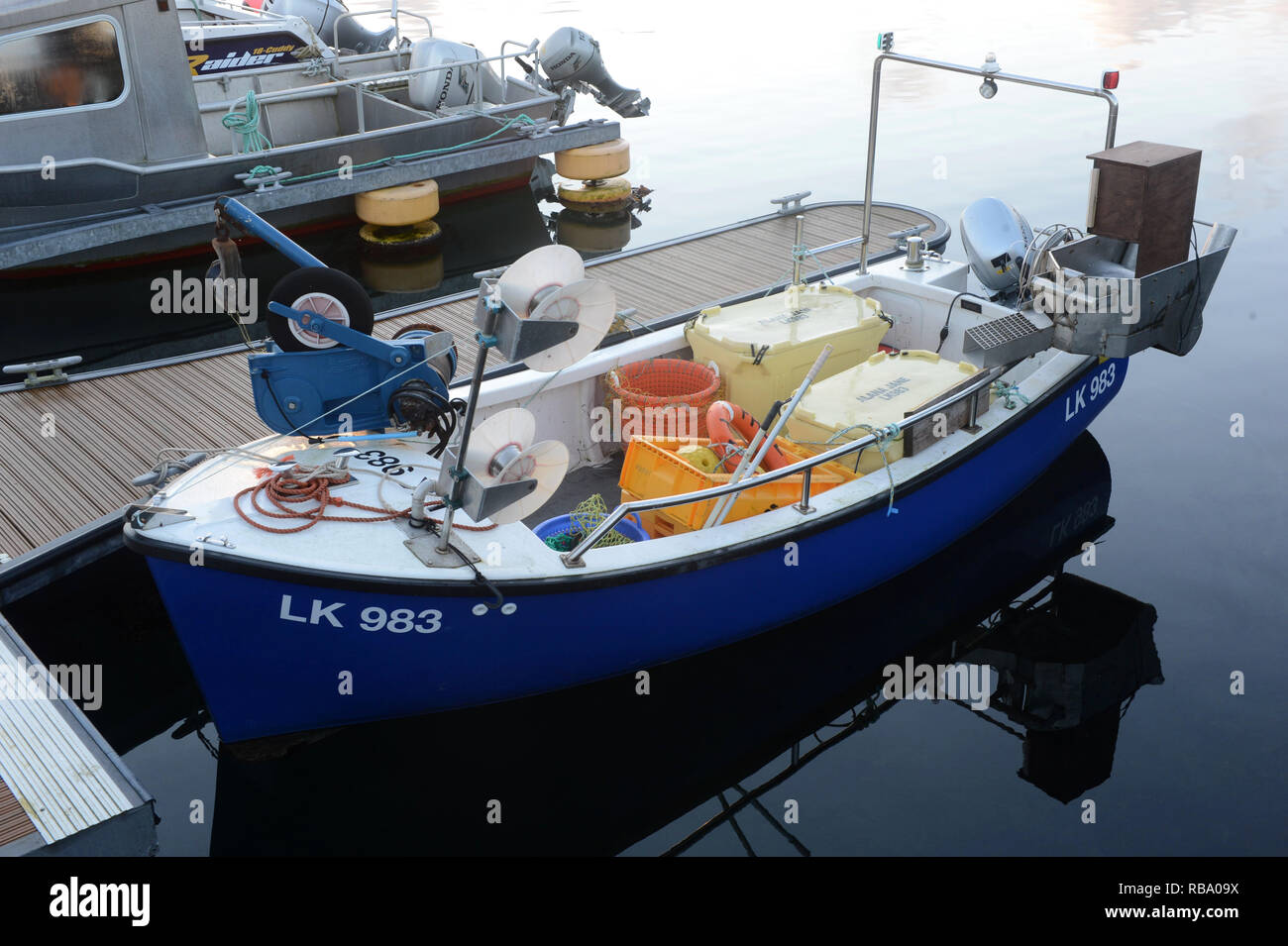 Hamnavoe boat harbour marina on a sunny morning on the island of Burra ...