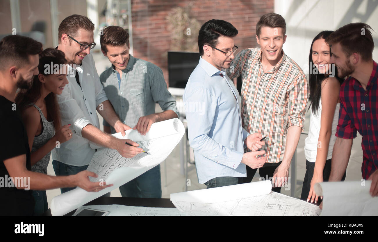 group of designers and architects discussing new sketches Stock Photo ...