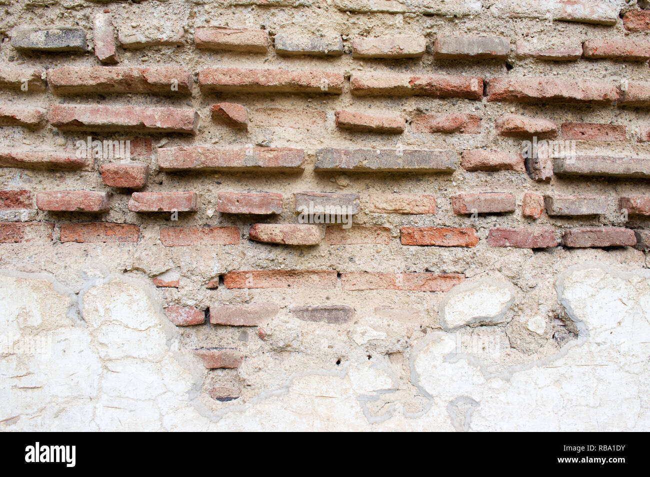 Old decayed stone brick wall background Stock Photo - Alamy
