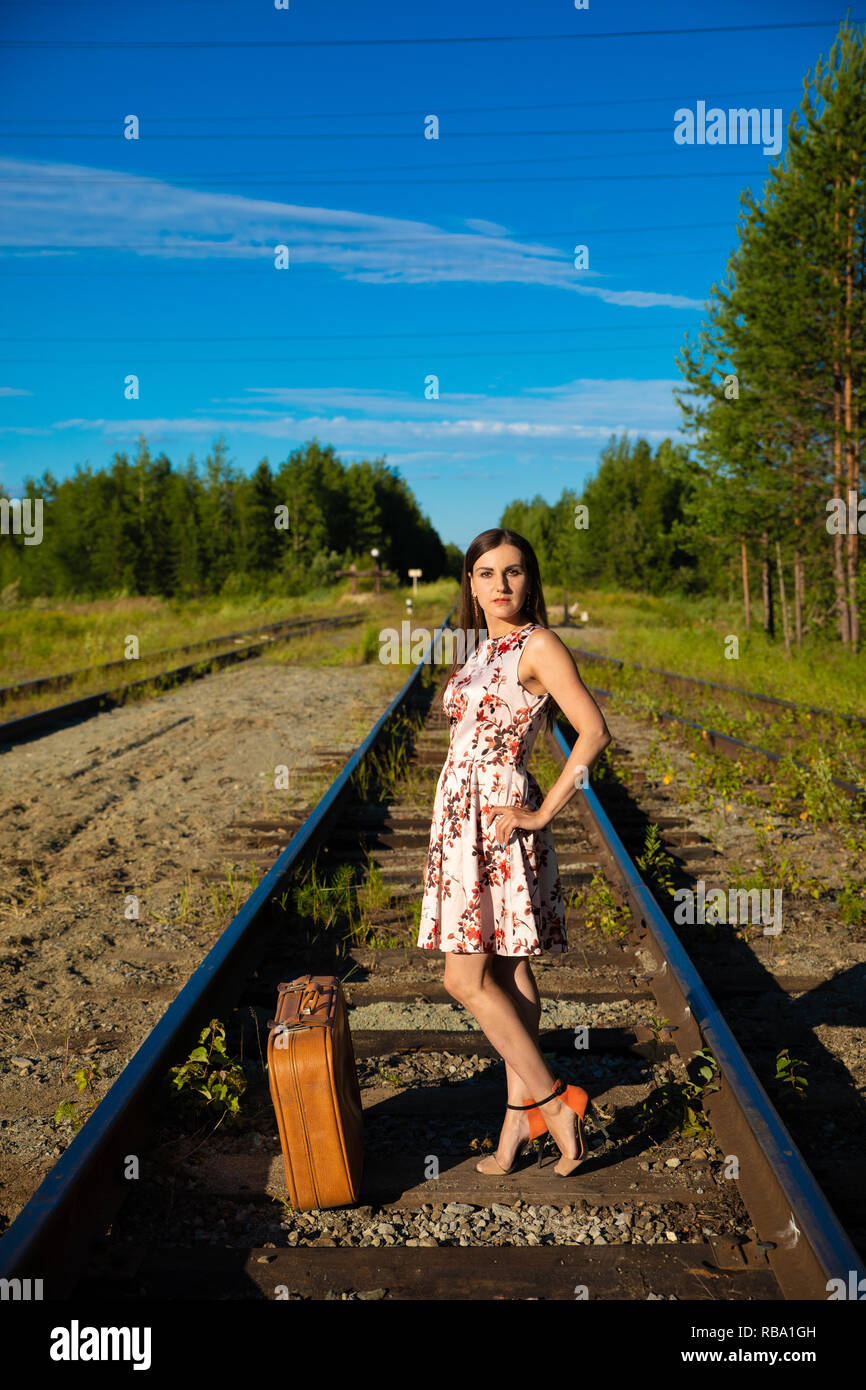 Girl standing on railroad track hi-res stock photography and images - Alamy