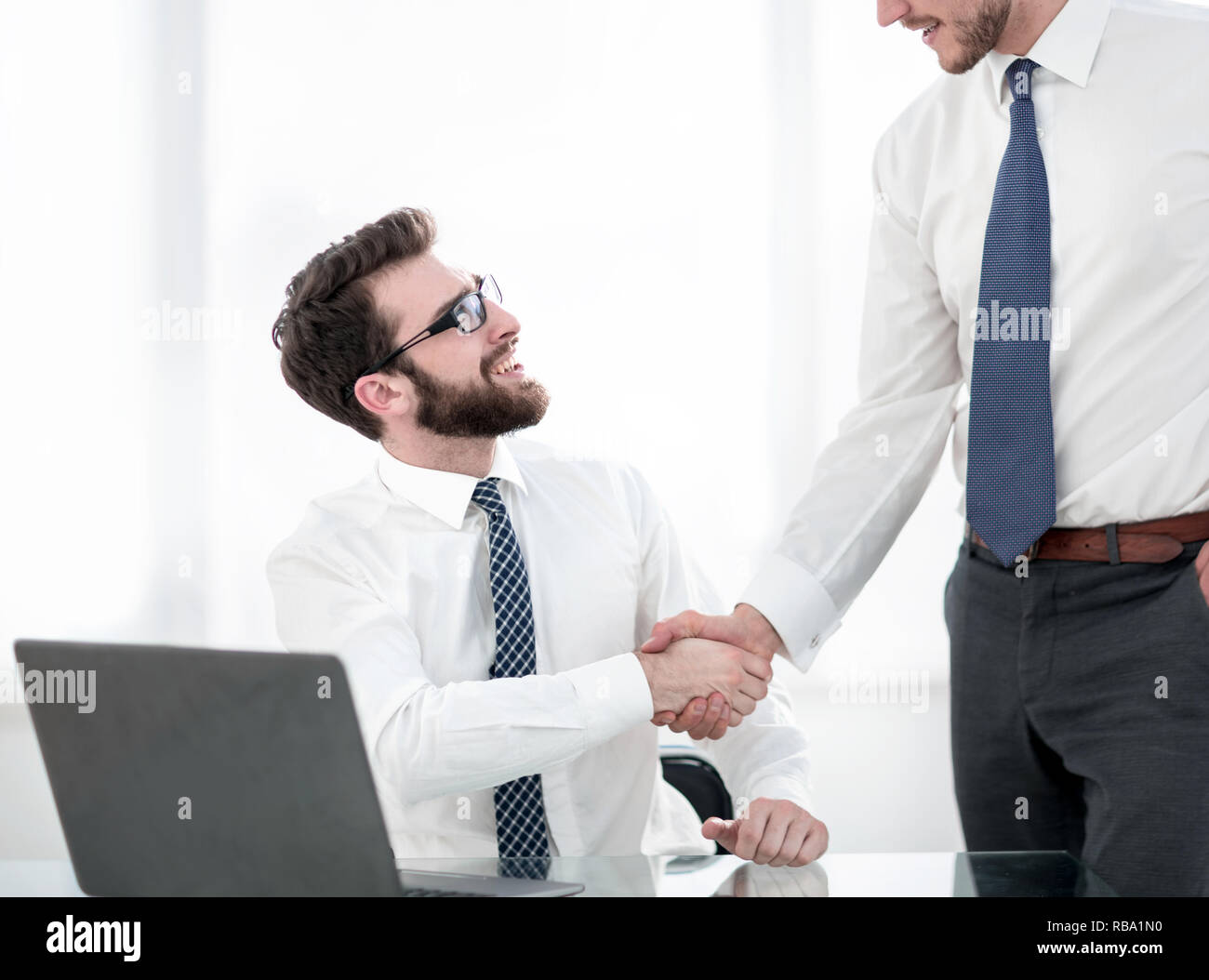handshake employees in the workplace in the office Stock Photo - Alamy