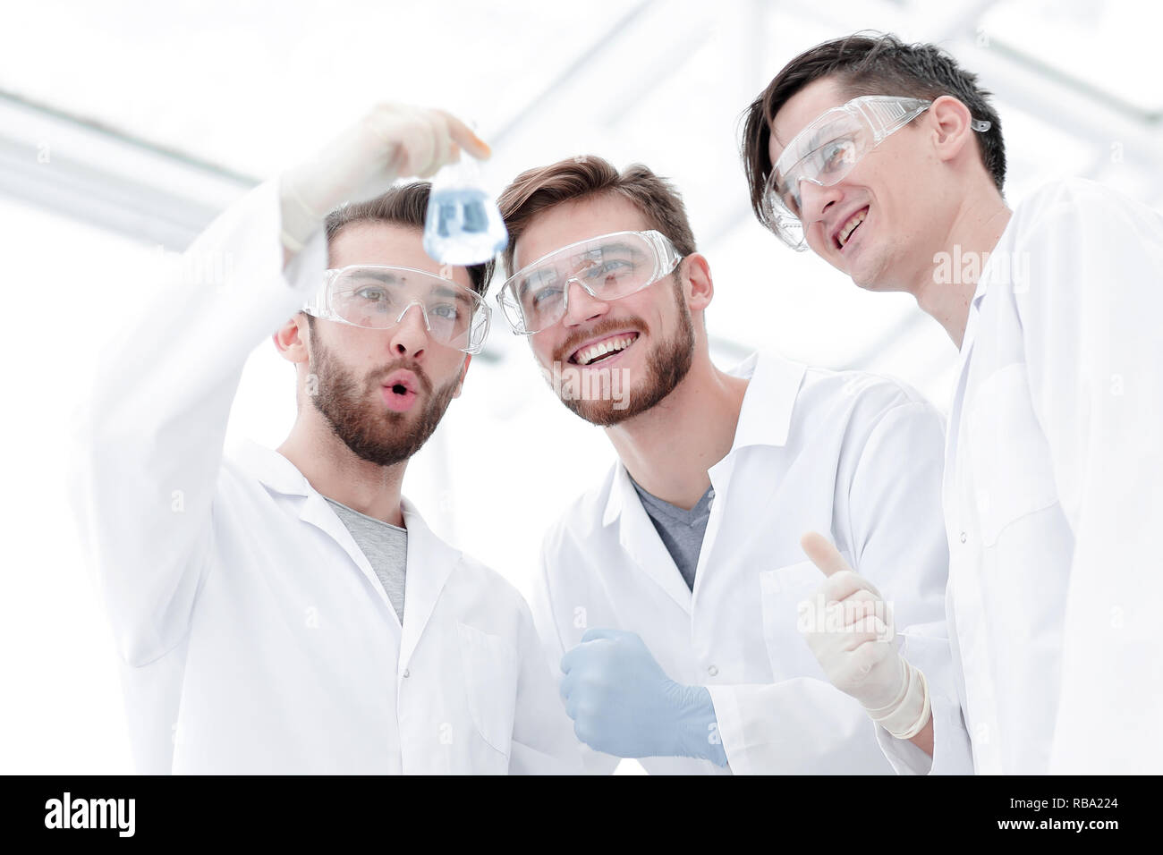 happy scientists look at the result of their work Stock Photo - Alamy