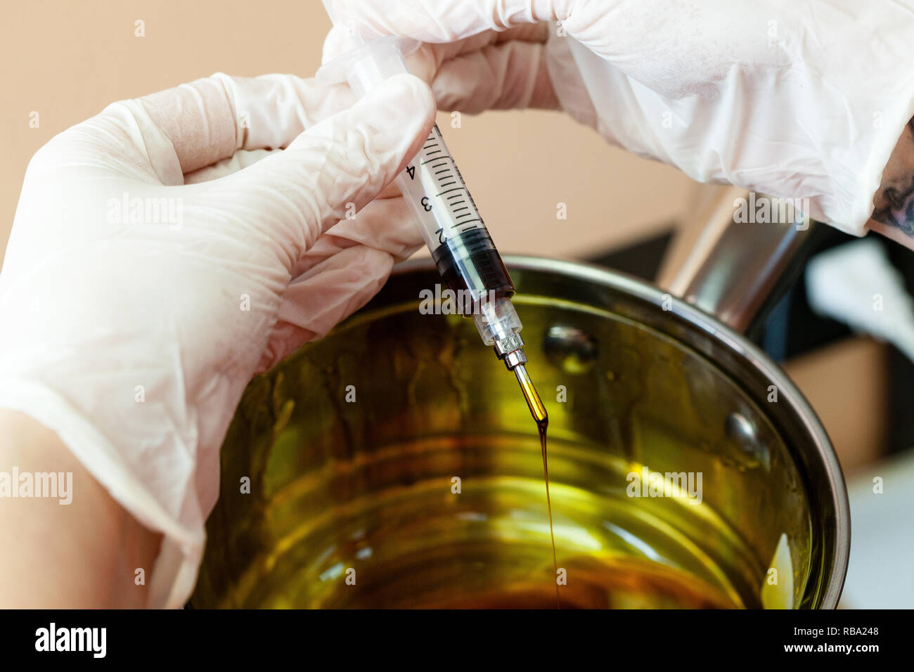 Marijuana grow room legal weed series - the gloved hands of a worker ...
