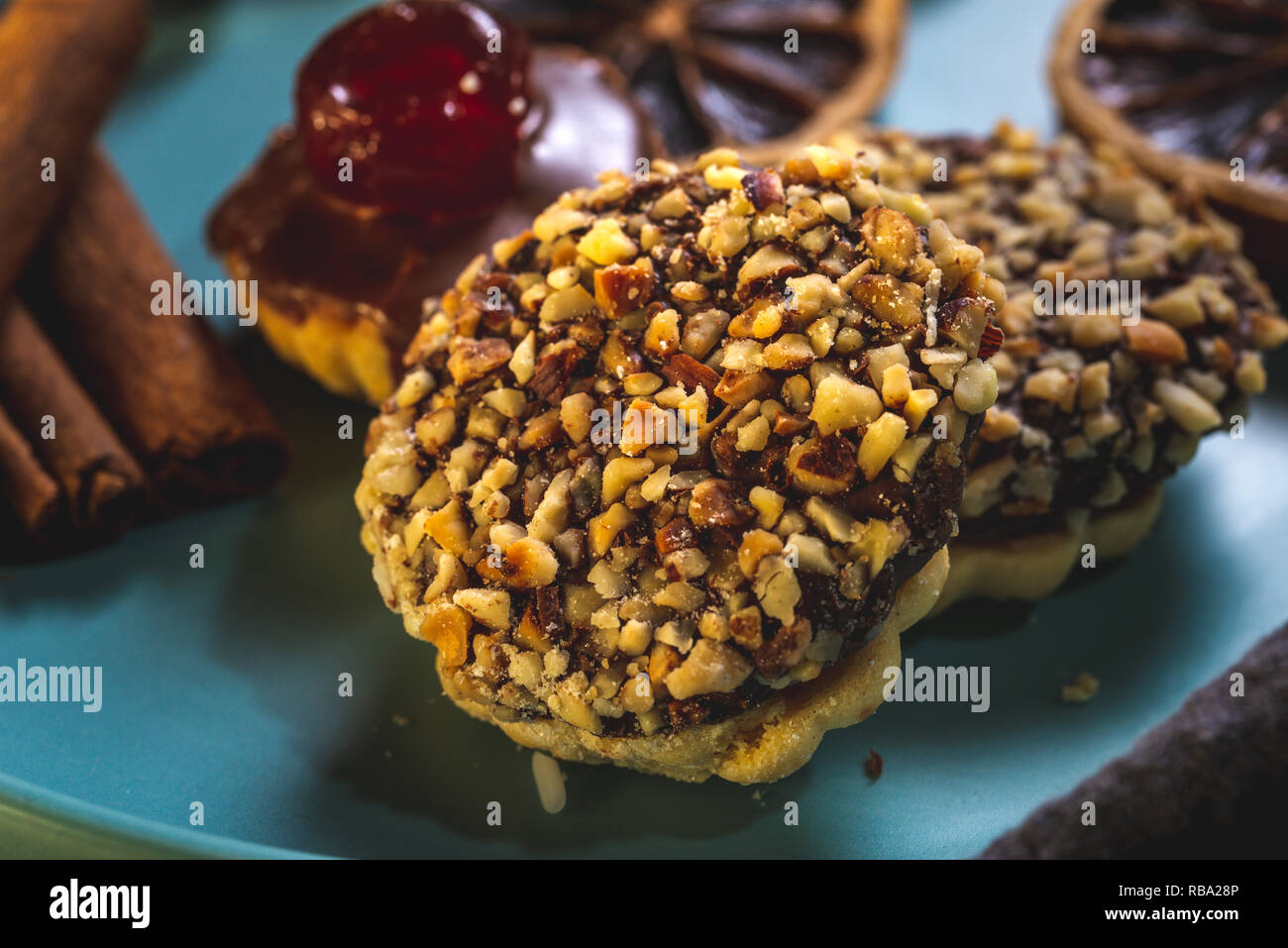 Horizontal photo with sweet rings stuffed by jam and with chocolate on ...