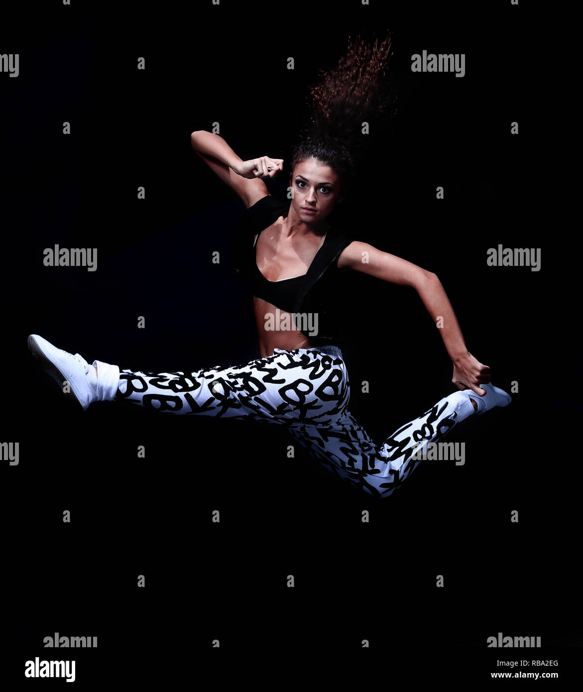 Girl jumping in hip hop style Stock Photo - Alamy