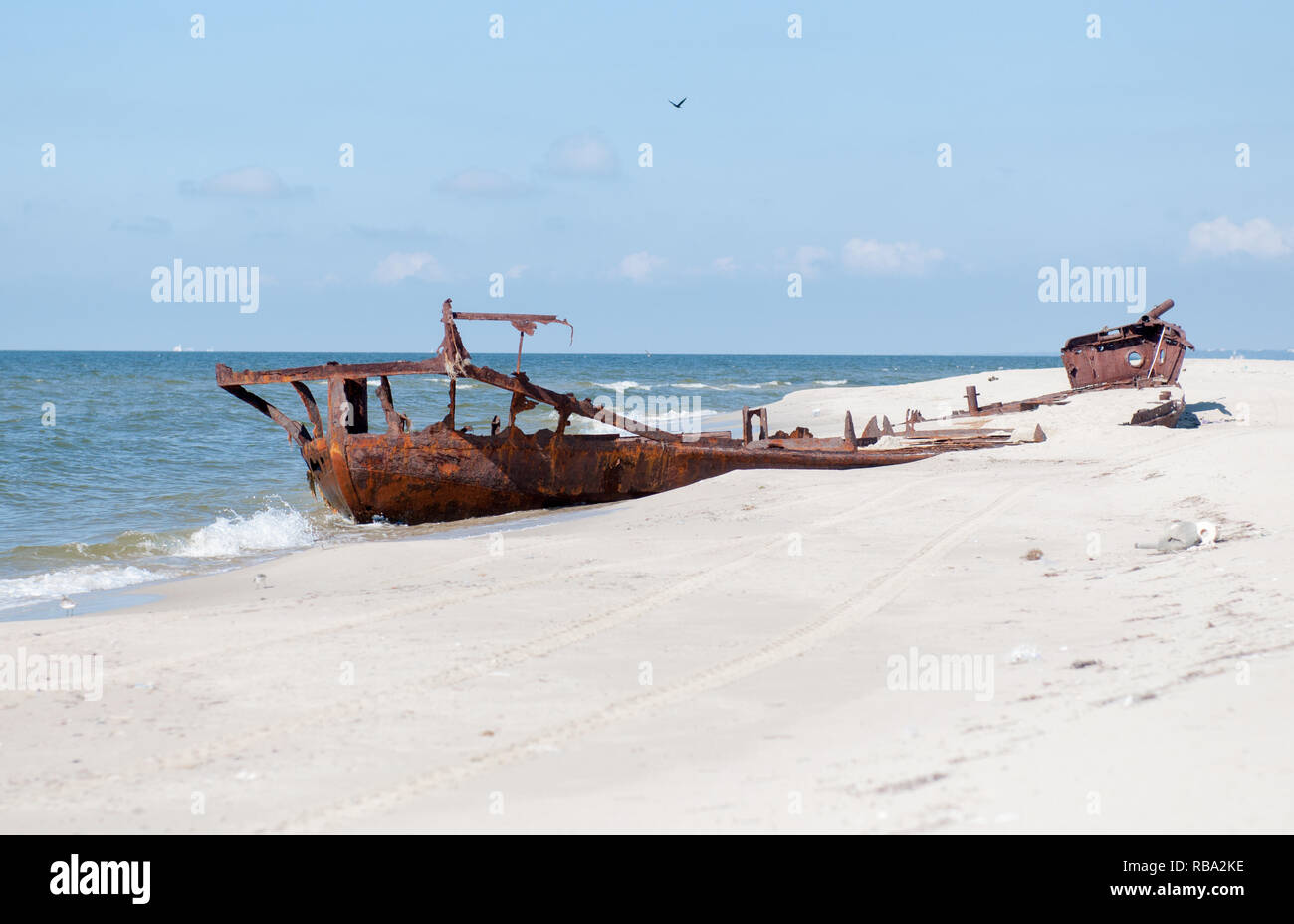 An old rusty ship. The Baltic Sea beach Stock Photo - Alamy