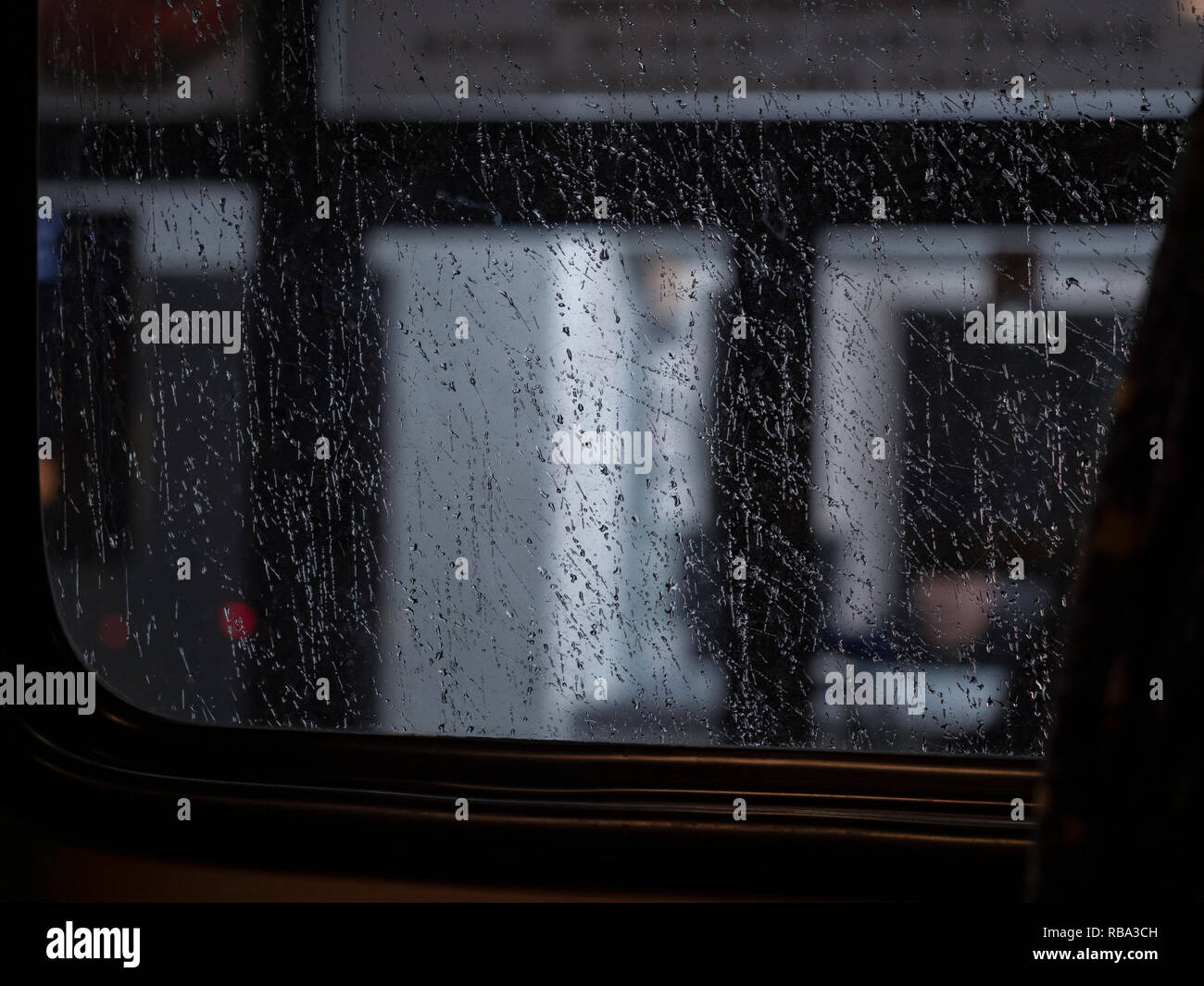 Rainy night rain drops sticked on tram window Stock Photo - Alamy