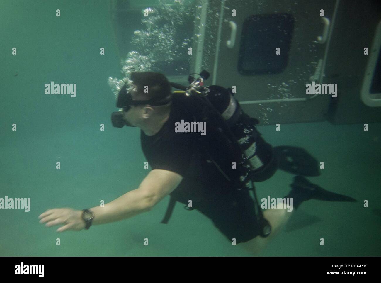 An underwater training instructor with the Water Survival Training ...