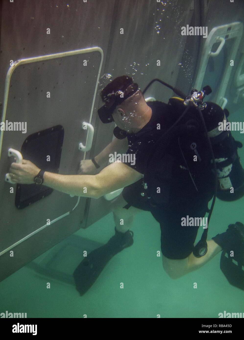 An underwater training instructor with the Water Survival Training ...