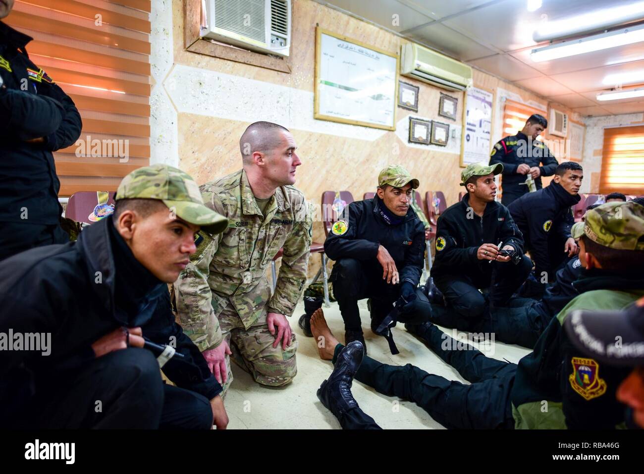 U.S. Army Maj. Steven Schauer, center left, 28th Combat Support ...