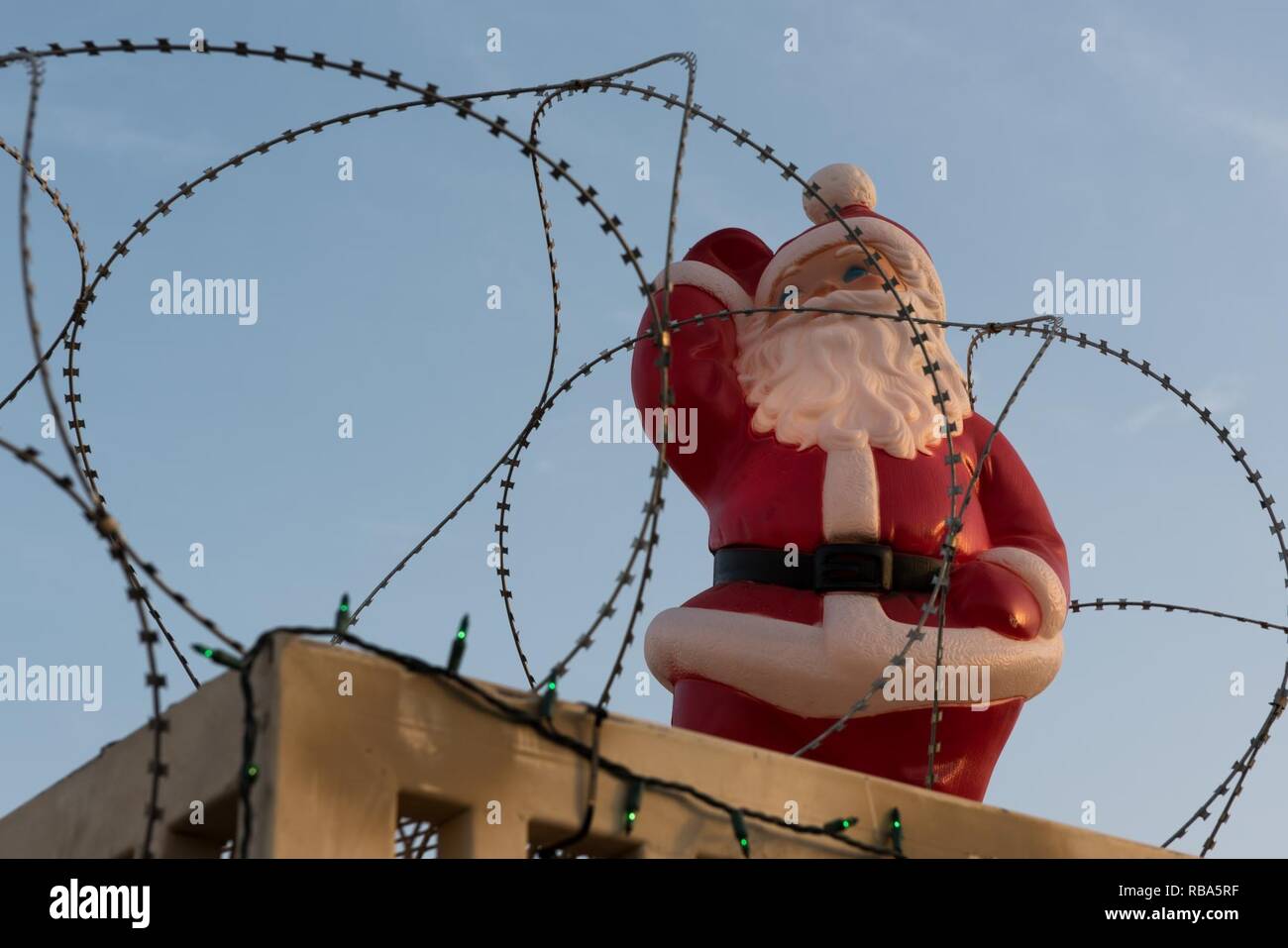 A decorative Santa Clause is seen nestled into constantine wire at the ...