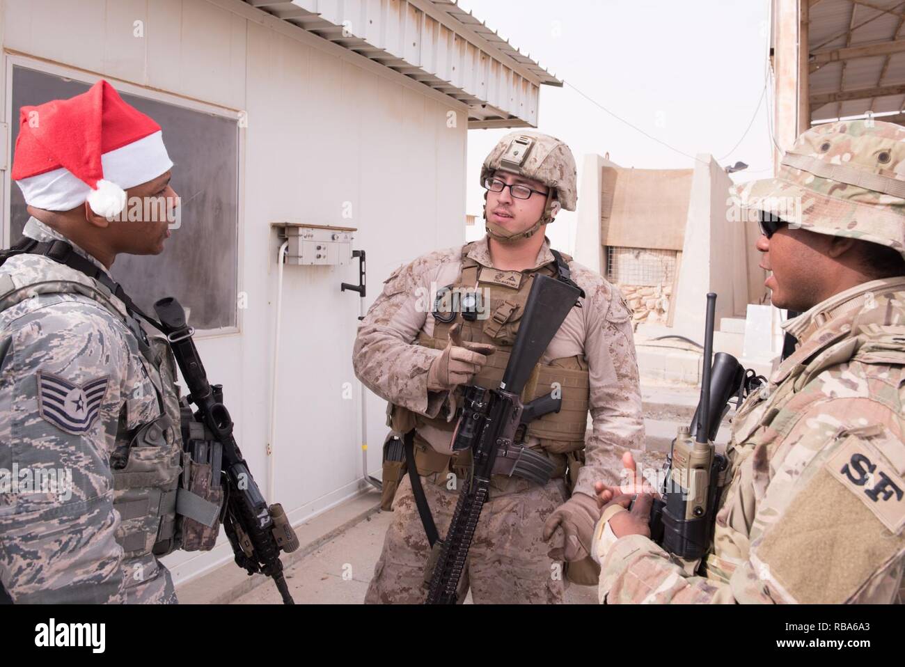 U.S. Air Force Tech. Sgt. Steven Cherry (left) relieves U.S. Marine ...