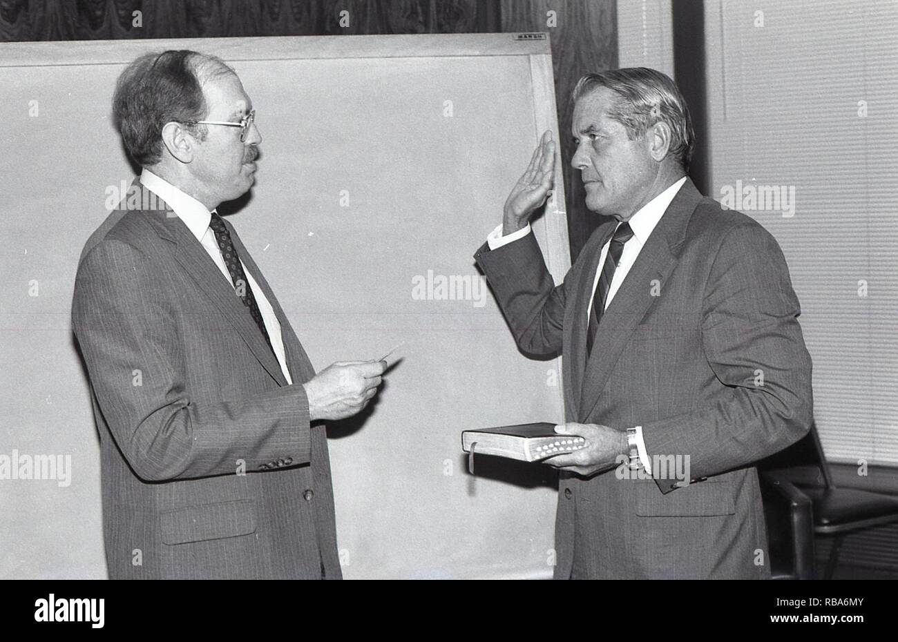 MAN SWEARING IN Stock Photo - Alamy