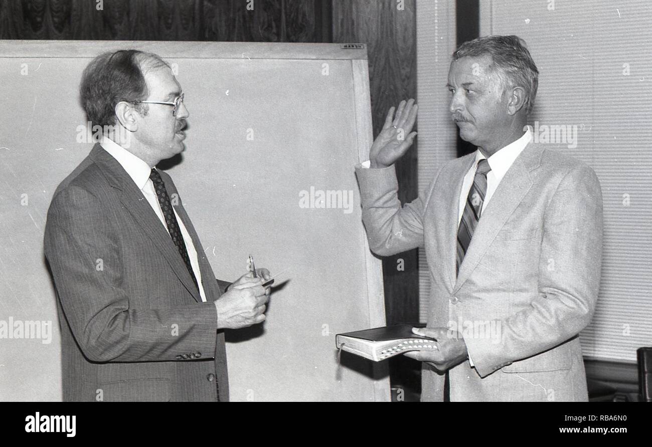 MAN SWEARING IN Stock Photo - Alamy