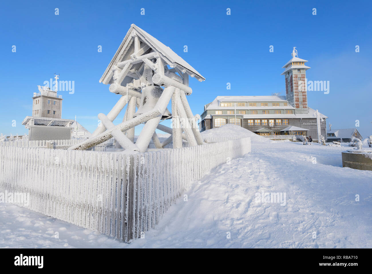 Peace bell, weather station and Fichtelberghaus, on the summit of ...