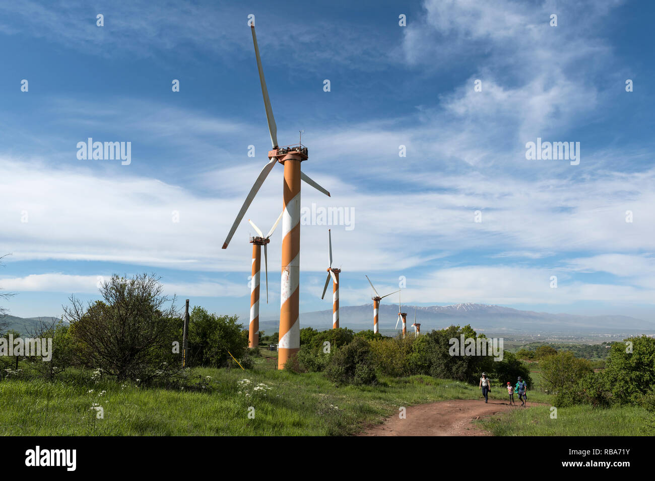 Israeli family hiking around Bnei Rasan Wind turbines near kibbutz Ein ...