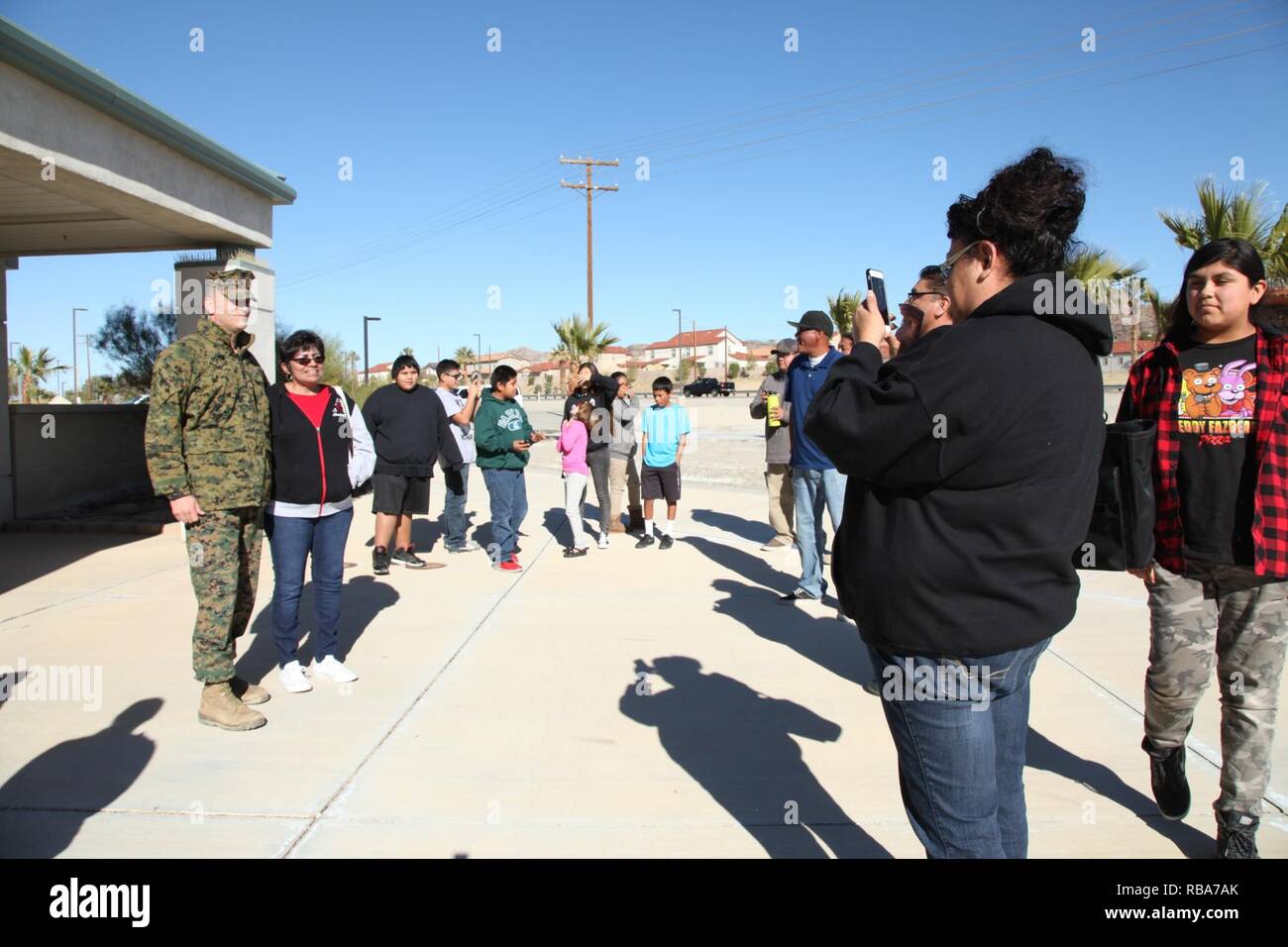 Daris Lafoon snaps a photo of Lt. Col. Timothy Pochop, director ...