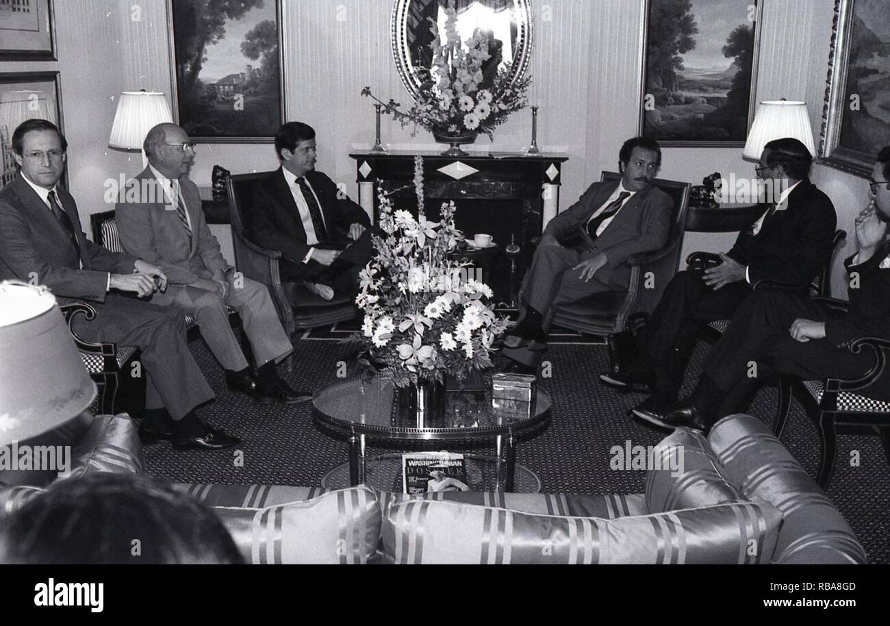 MEN SITTING AROUND THE ROOM Stock Photo - Alamy