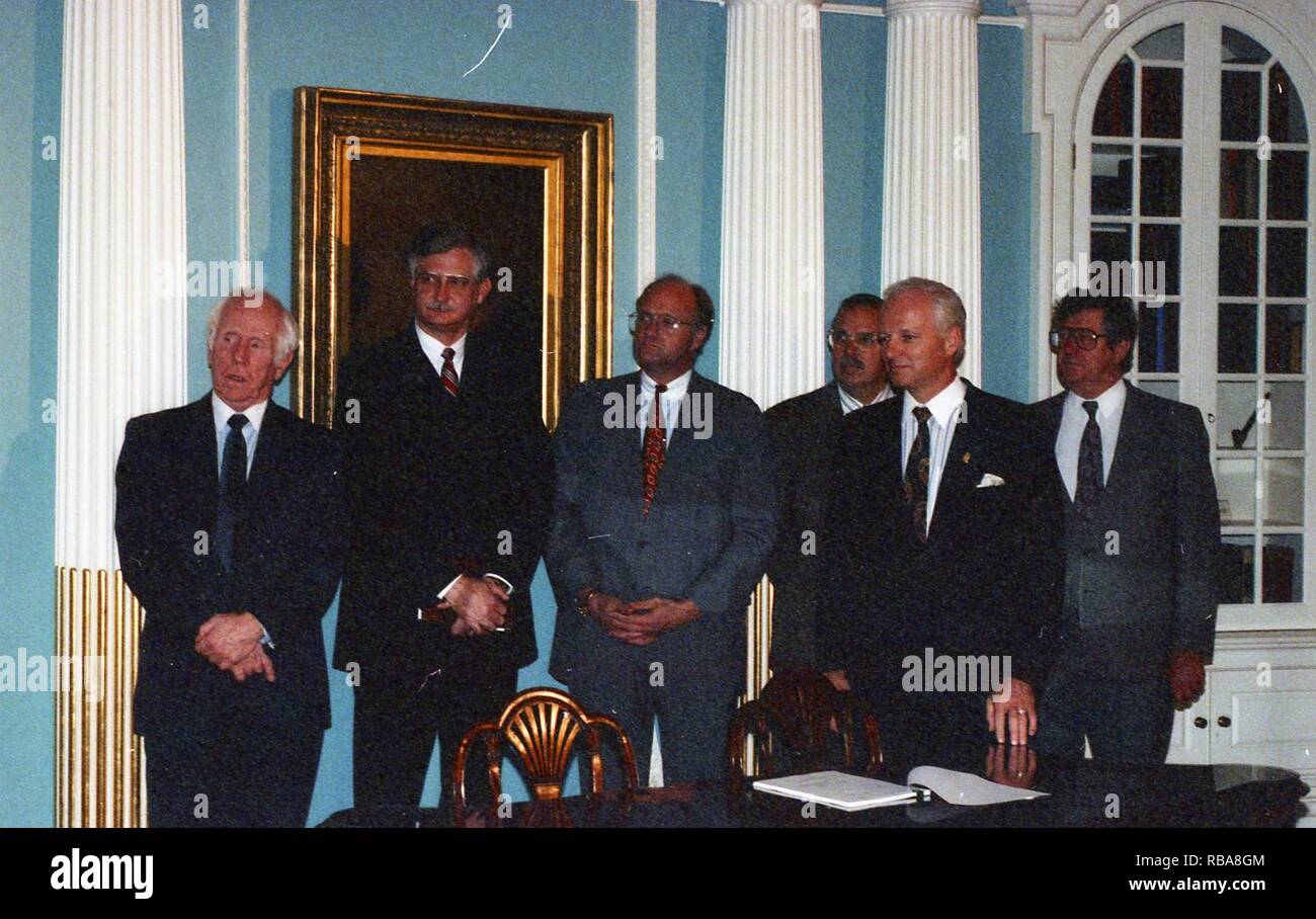 MEN GATHERED IN A GROUP Stock Photo - Alamy
