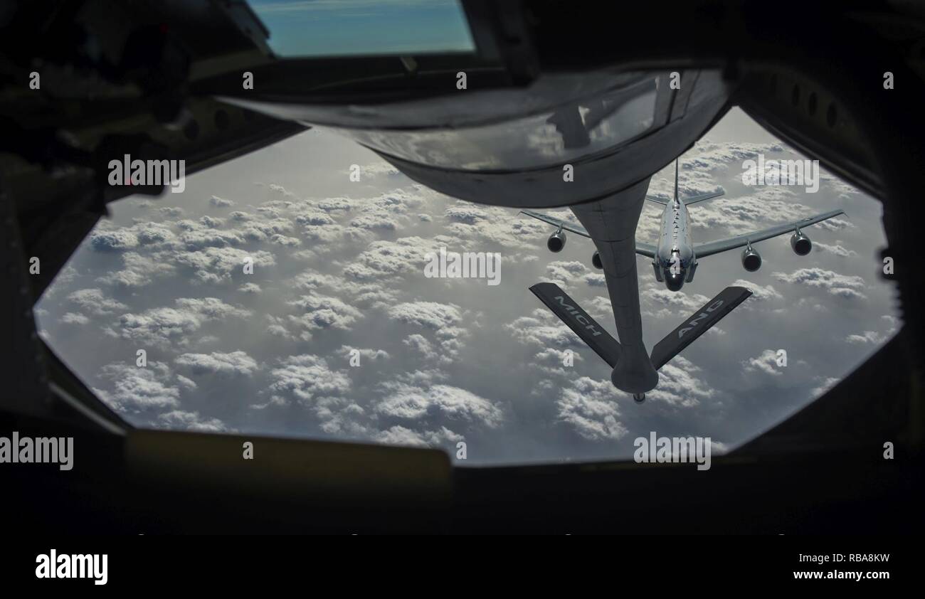 A U.S. Air Force RC-135 Rivet Joint approaches a KC-135 Stratotanker ...