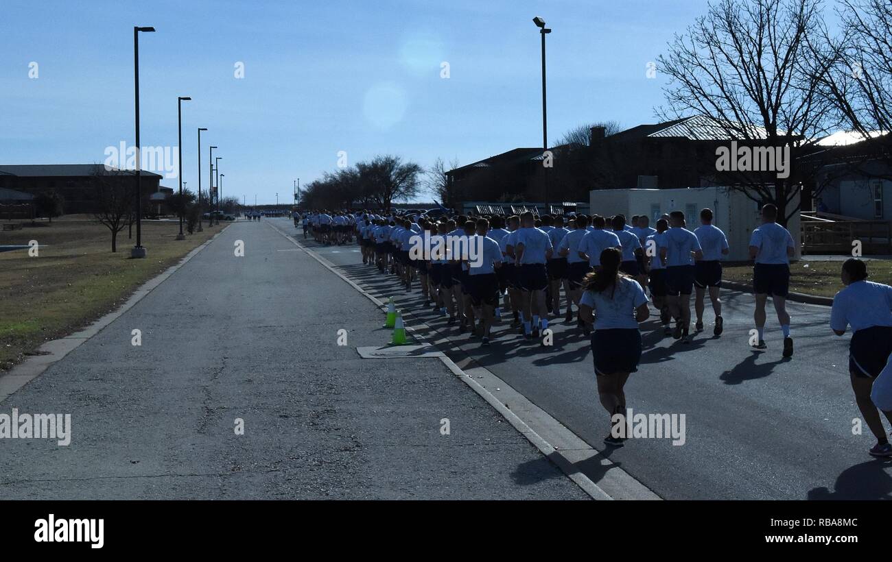 U.S. Air Force Airmen run in formation during the 17th Training Group ...