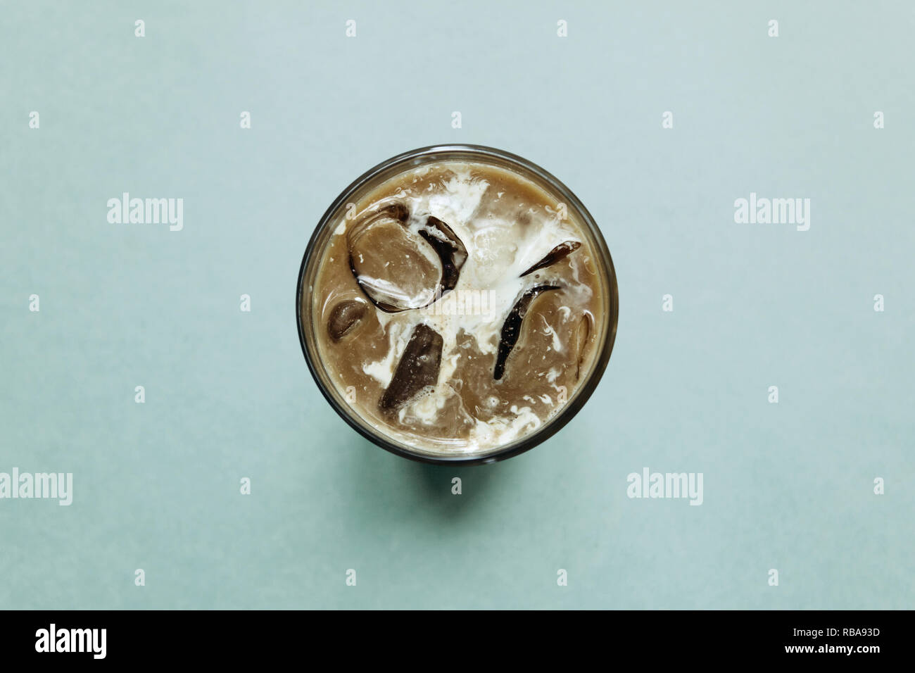 Top view close-up on aromatic fresh iced coffee on a green background ...