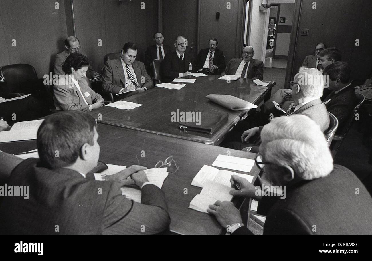 MEN AND WOMEN AT CONFERENCE TABLE Stock Photo - Alamy