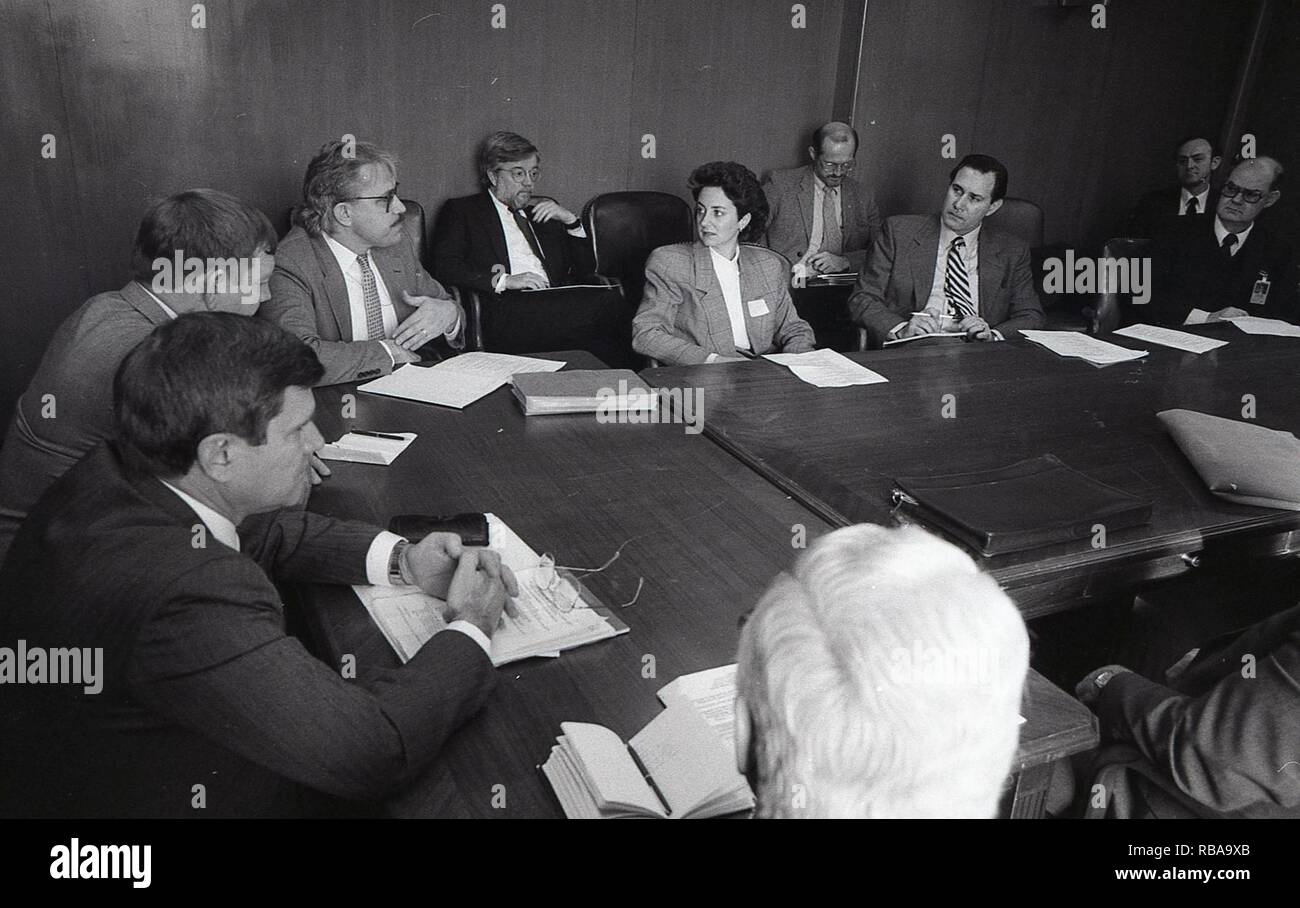 MEN AND WOMEN AT CONFERENCE TABLE Stock Photo - Alamy