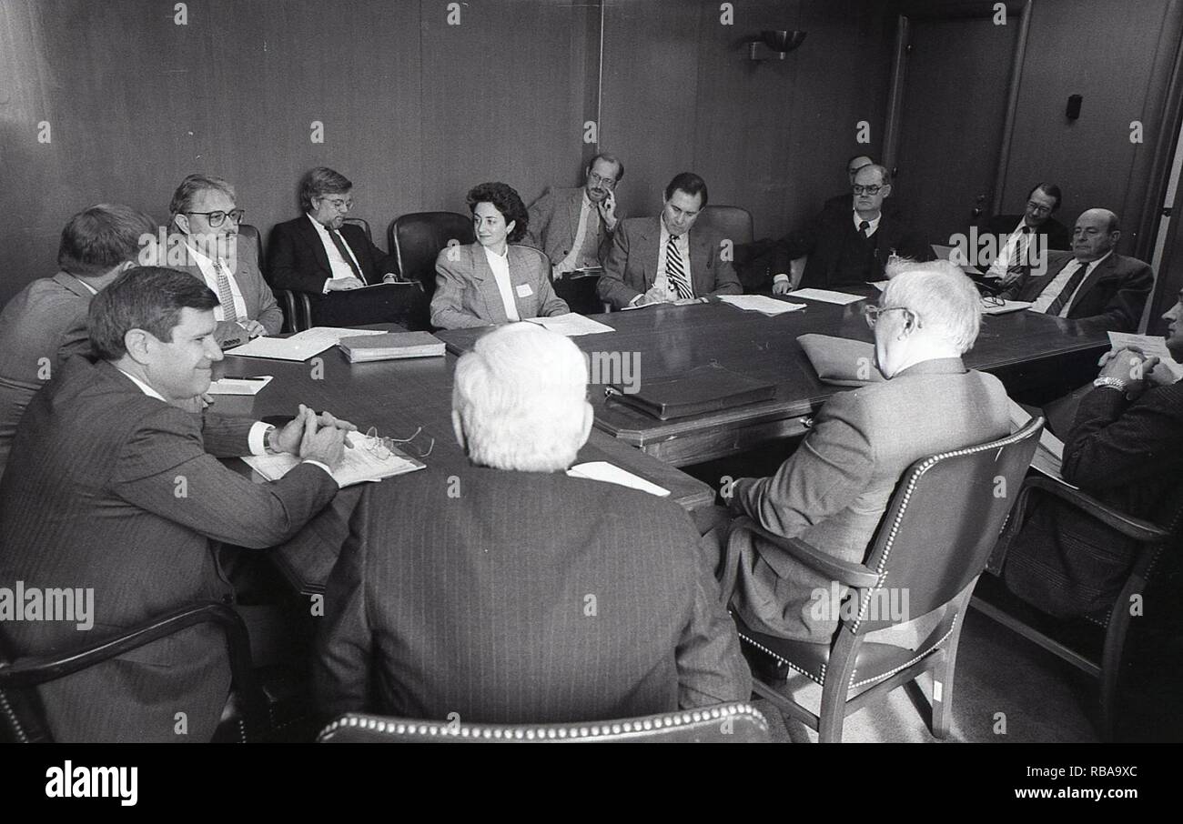 MEN AND WOMEN AT CONFERENCE TABLE Stock Photo - Alamy