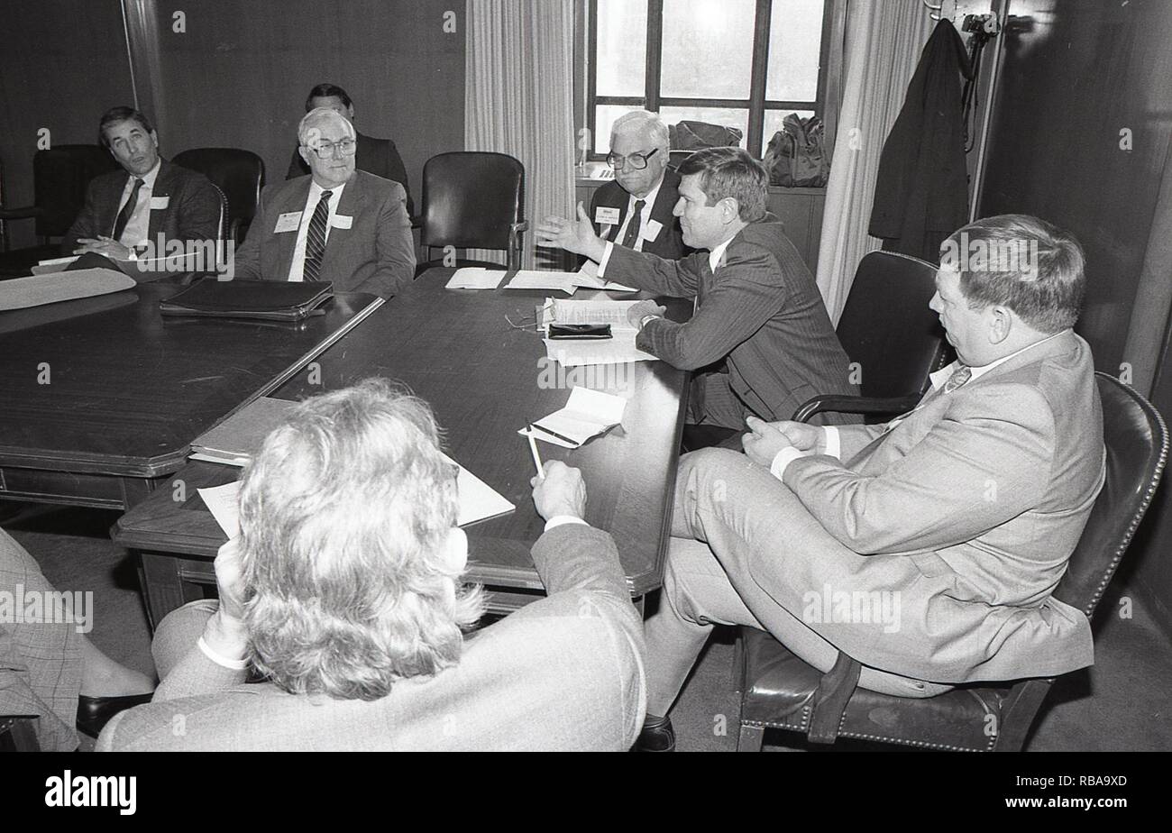 MEN AND WOMEN AT CONFERENCE TABLE Stock Photo - Alamy