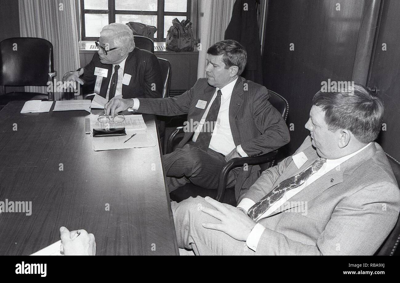 MEN AND WOMEN AT CONFERENCE TABLE Stock Photo - Alamy