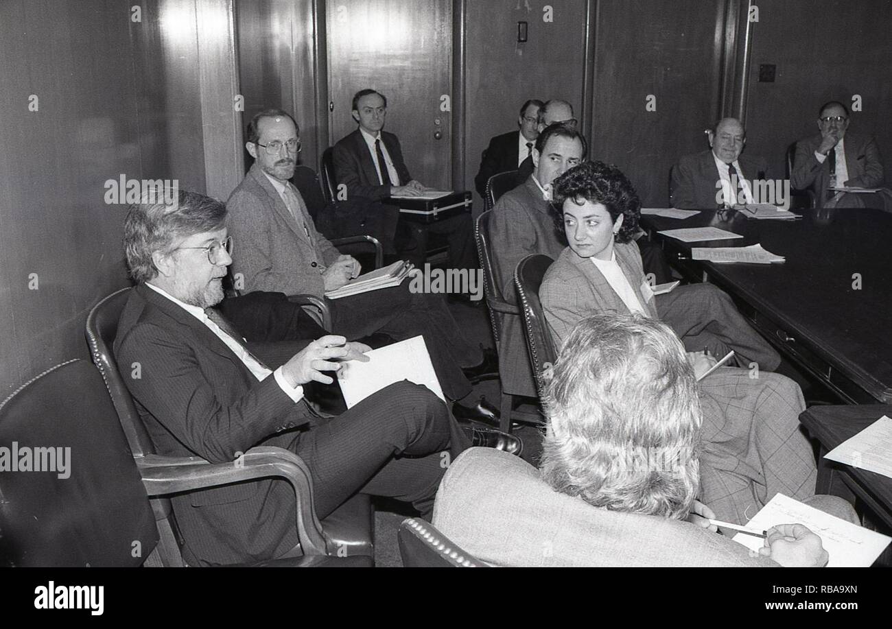 MEN AND WOMEN AT CONFERENCE TABLE Stock Photo - Alamy