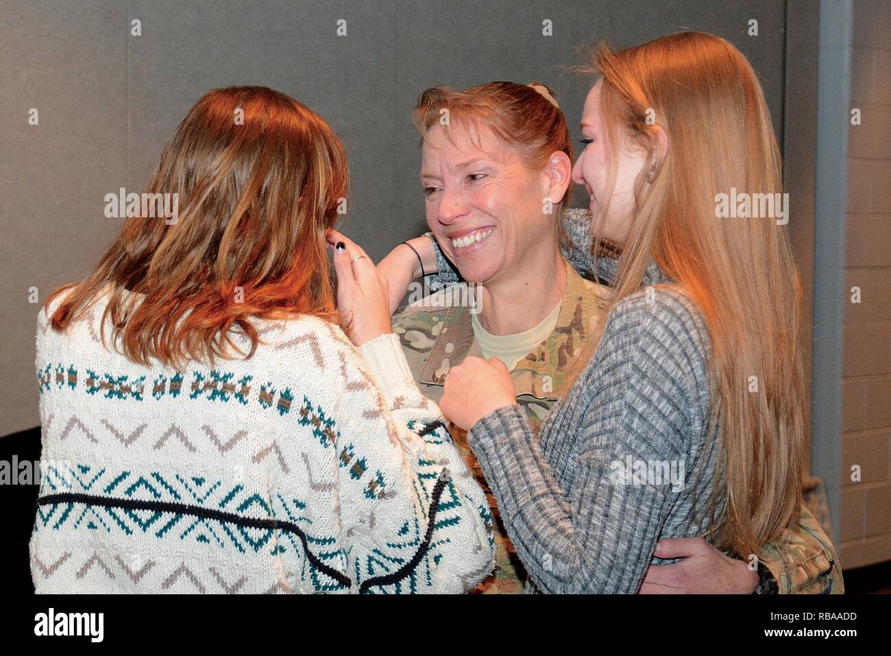 Col. Beth Prekker surprises her daughters, Lindsay and Caroline with an ...