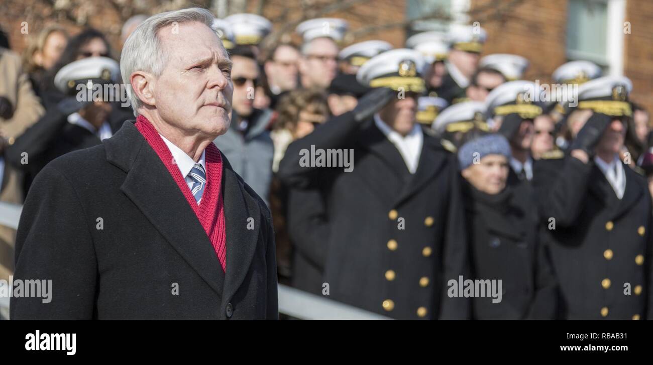 The Honorable Raymond E. Mabus, secretary of the Navy, stands during ...