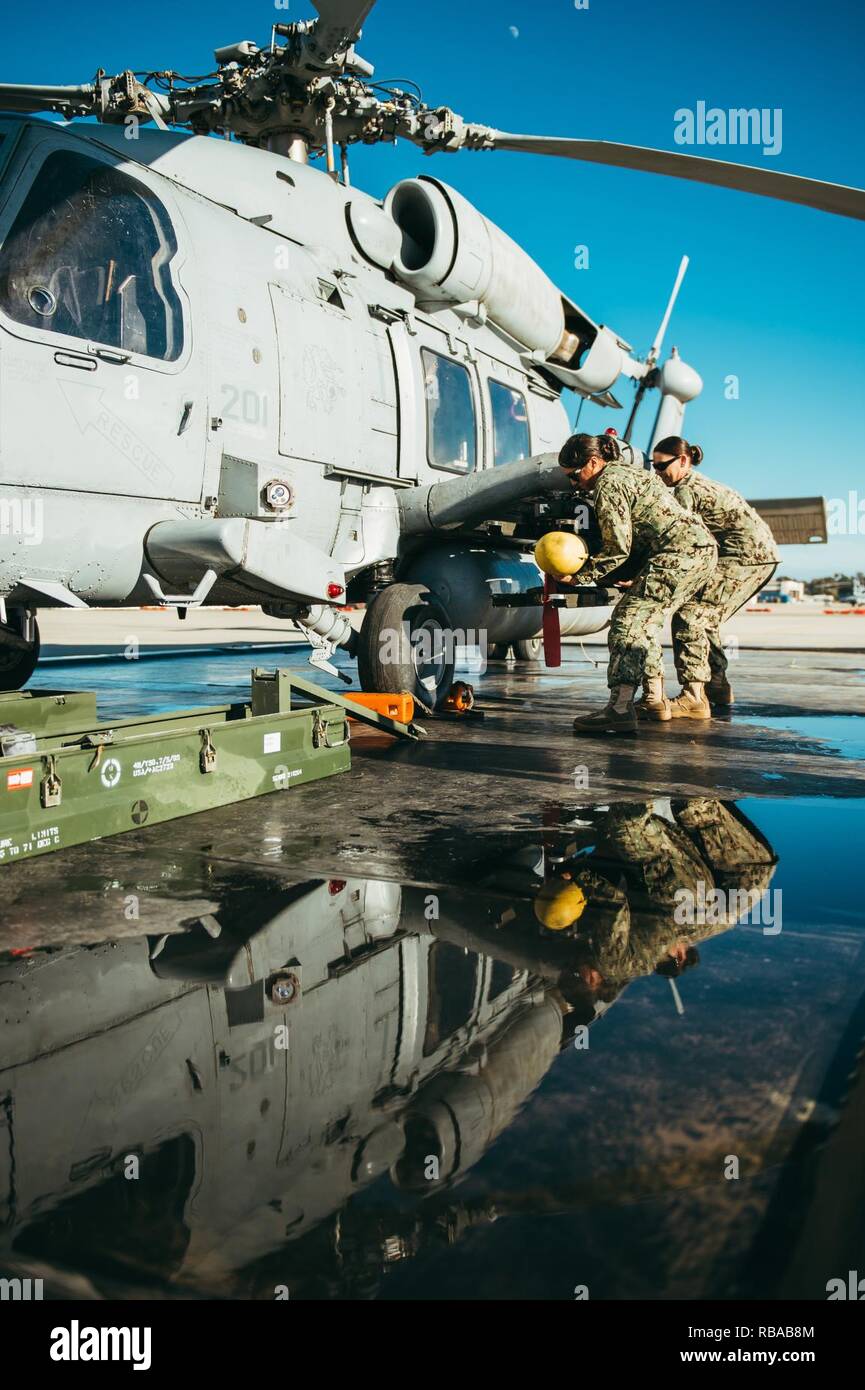 - Aviation Ordnanceman 2nd Class Xiomara Flores (front) and Aviation ...