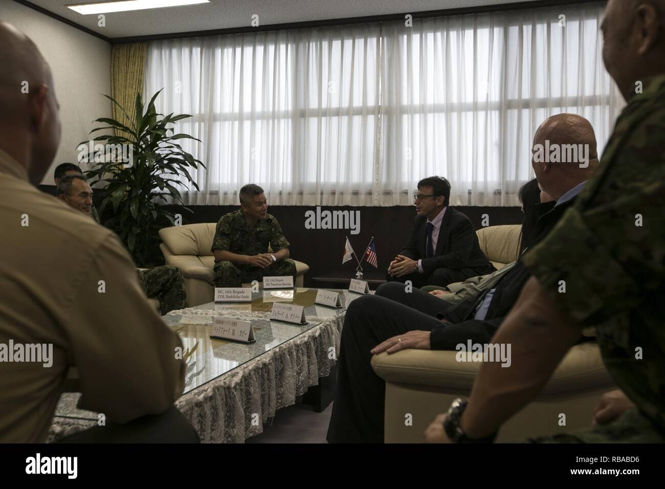 Maj. Gen. Tomofusa Harada, center left, and Mr. John Peters, center ...