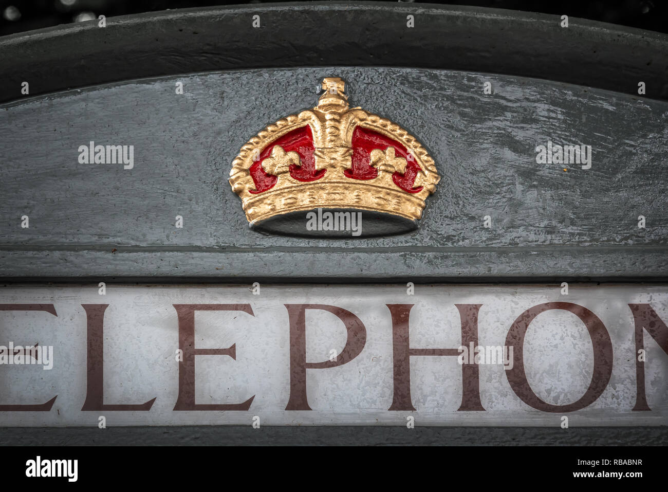 Close up of a royal crown symbol on an english grey phone booth in Bath ...
