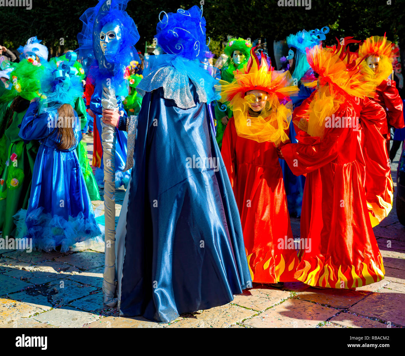 Young people and children with beautiful and colorful clothes during ...