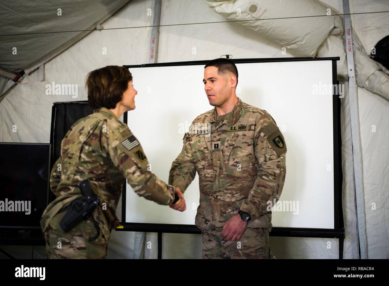 U.S. Army Capt. Dean Cocozza, right, 28th Combat Support Hospital ...
