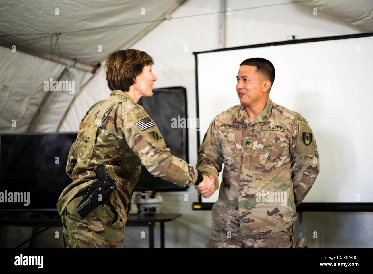 U.S. Army Sgt. Ruel Espiritu, right, 28th Combat Support Hospital ...
