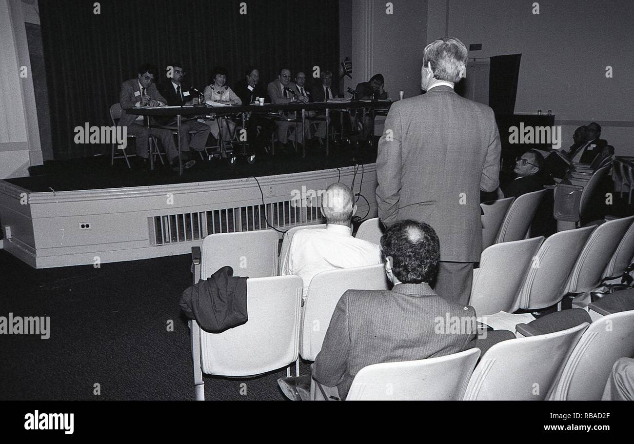 MAN STANDING IN AUDITORIUM SPEAKING Stock Photo - Alamy