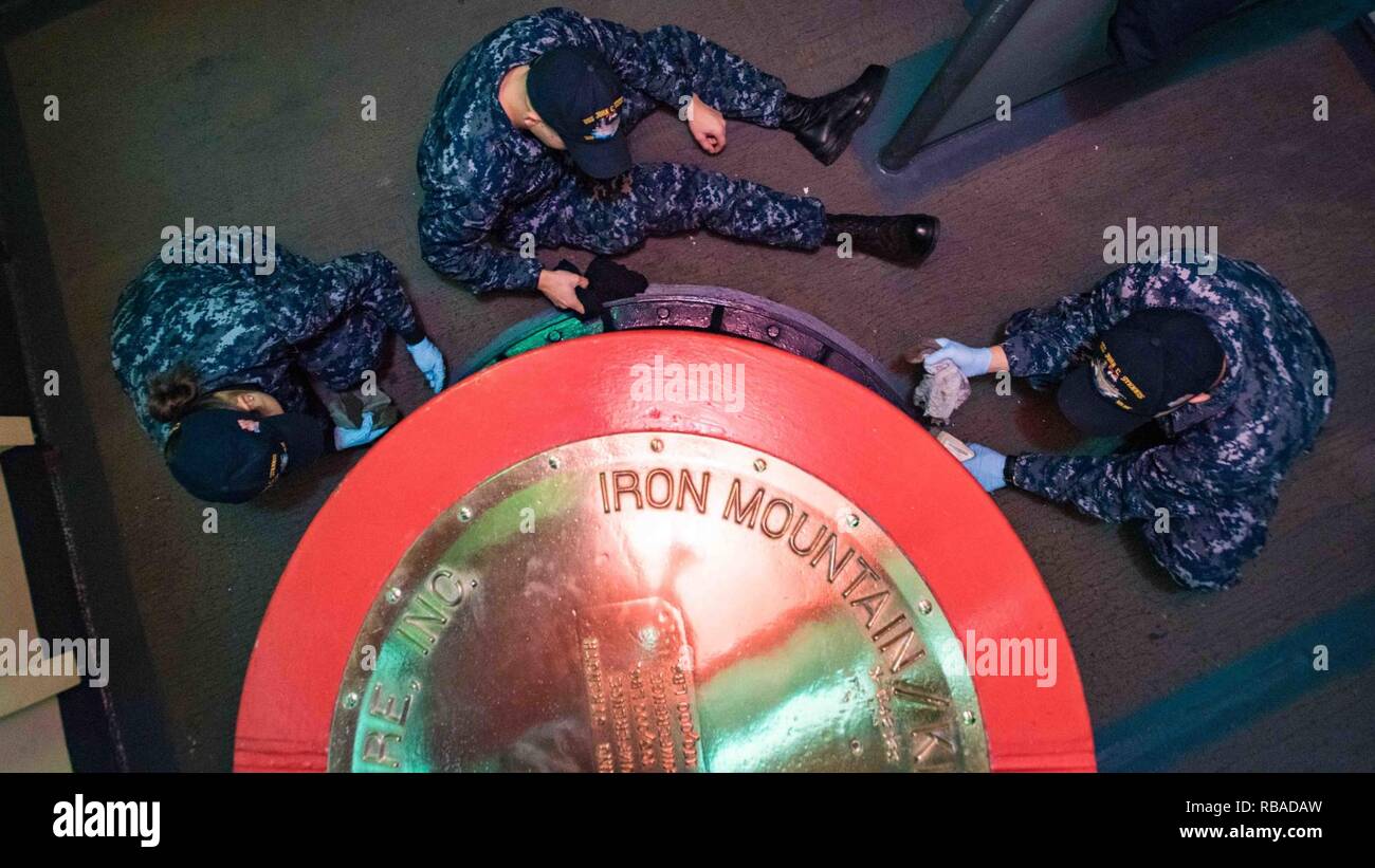 BREMERTON, Wash. (Jan. 9, 2017) Sailors clean a capstan in the ...