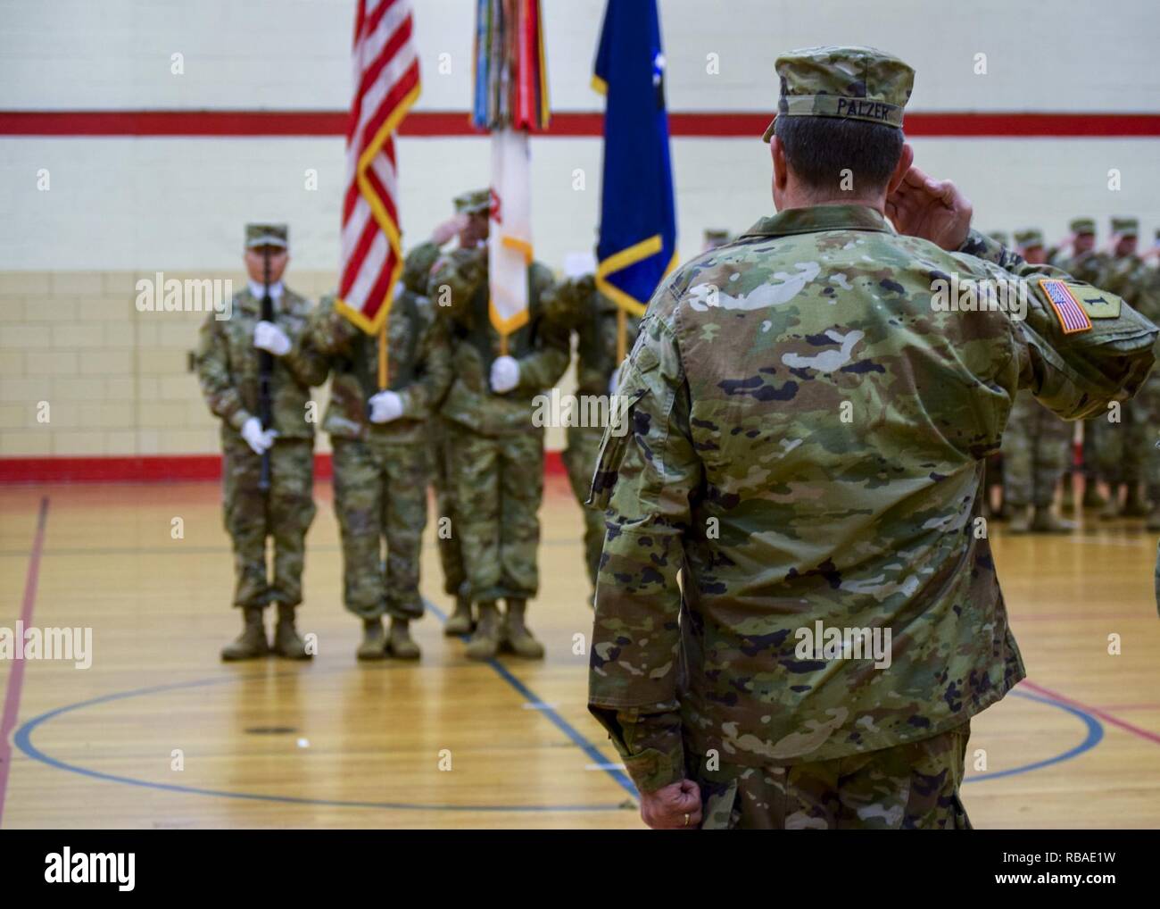 Maj. Gen. Mark W. Palzer, the incoming commanding general salutes ...